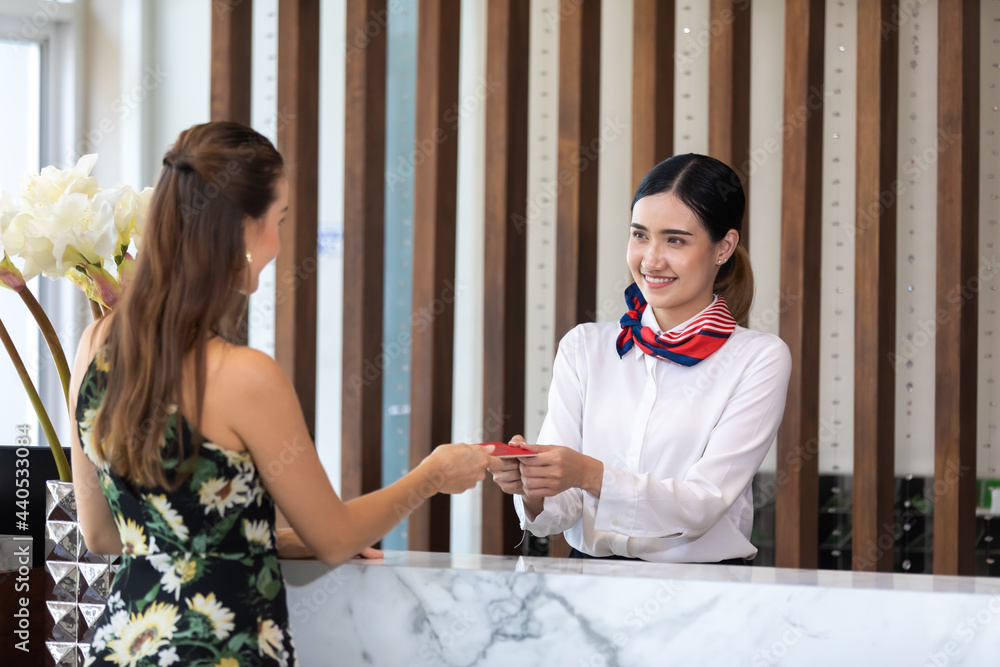 beautiful young asian woman receptionists working at a reception desk ...