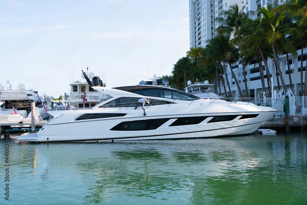 Yacht berth in Miami, USA. Luxury yachts docked at pier. Modern sea ...