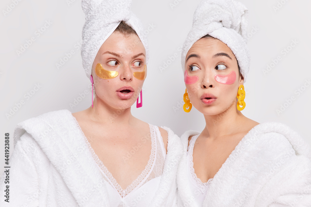 Surprised ladies look with wonder at each other test new eye patches to ...