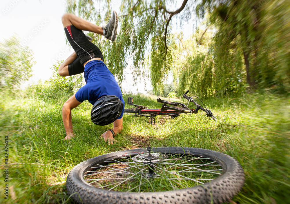 Man falling from the bike on the pathway in the countryside Stock Photo ...