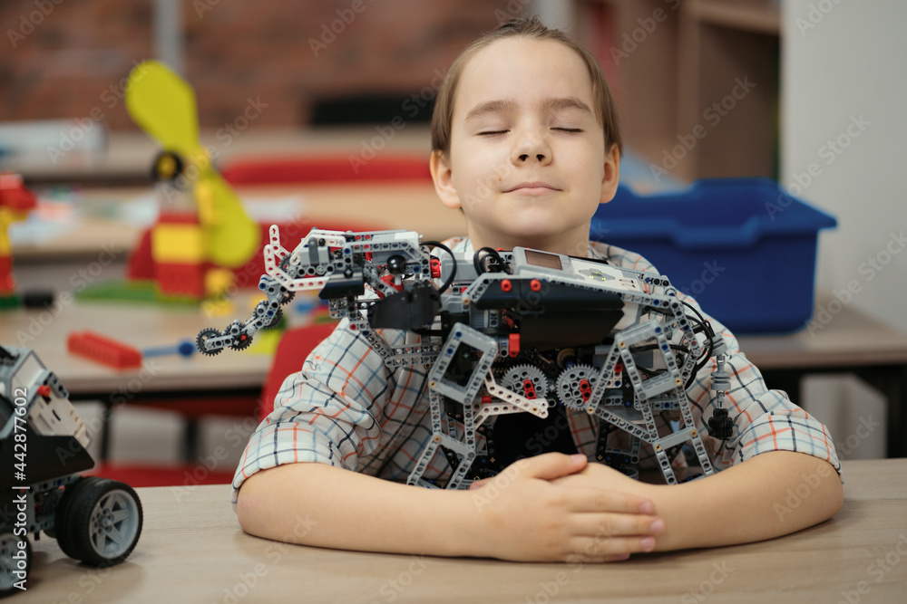 Boy Works on a Fully Functional Programable Robot for His School ...