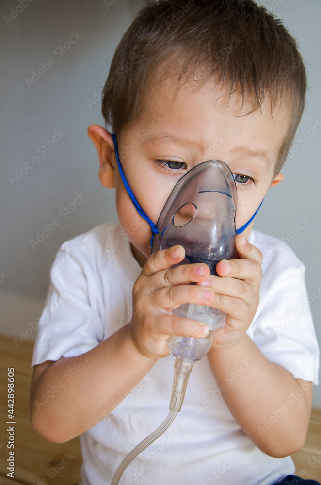 Boy, European appearance cold and doing inhalation. A 3-year-old baby ...