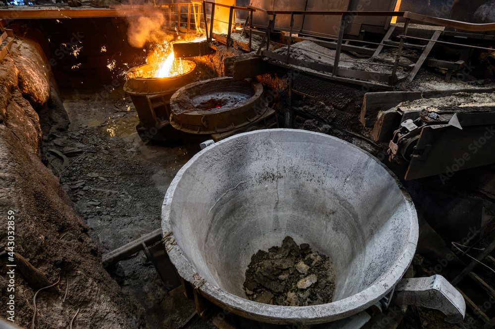 Special metallurgical ladles. The process of pouring molten metal Stock ...