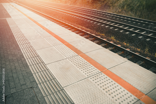 Train platform pavement floor with pattern. Railway station with yellow ...