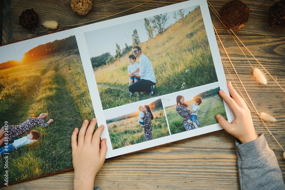 Luxury wooden photo book on natural background. Family memories ...