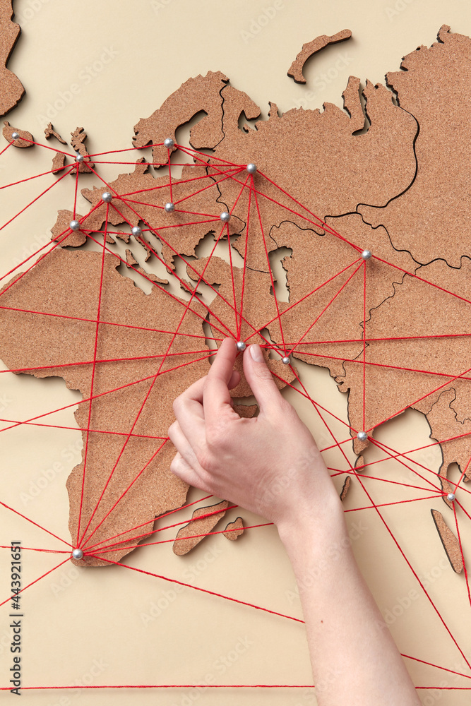 Woman putting pin on map with connections Stock Photo | Adobe Stock