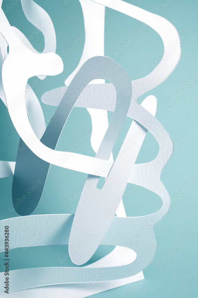 Interlocking Papercraft Sculpture on Blue Stock Photo | Adobe Stock