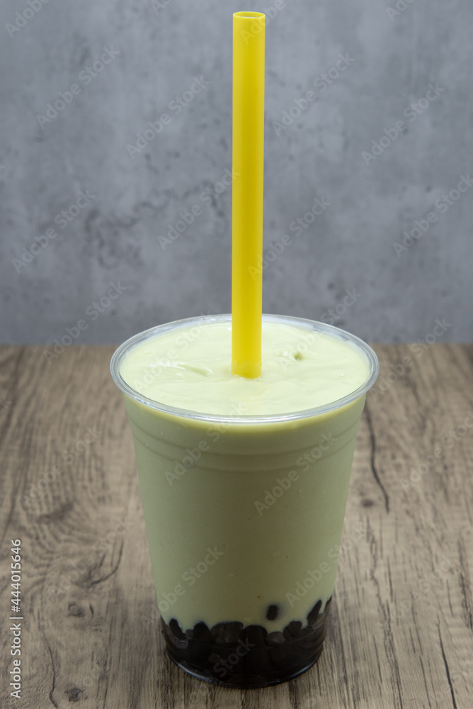 Avocado flavored smoothie with sweet tapioca boba balls at the bottom ...