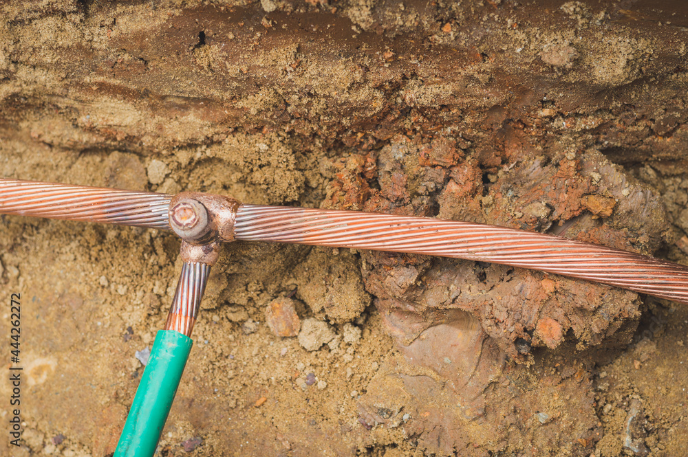 Welding copper ground wire on ground rod.Welding copper ground wire ...