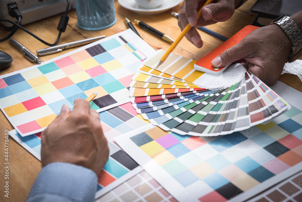 Interior designer chooses a color chart for home design. Graphic ...