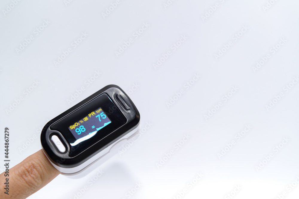 White portable fingertip pulse oximeter with multi-colored display ...