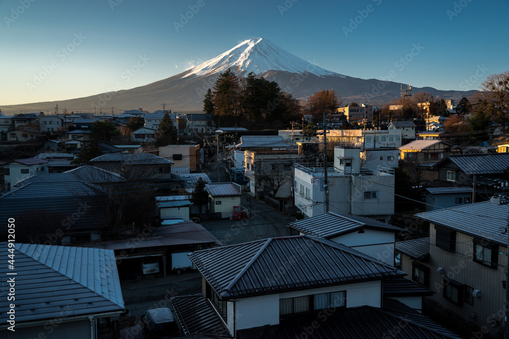 Morning view of Mount Fuji from Kawaguchiko town in Japan. Snow covered ...
