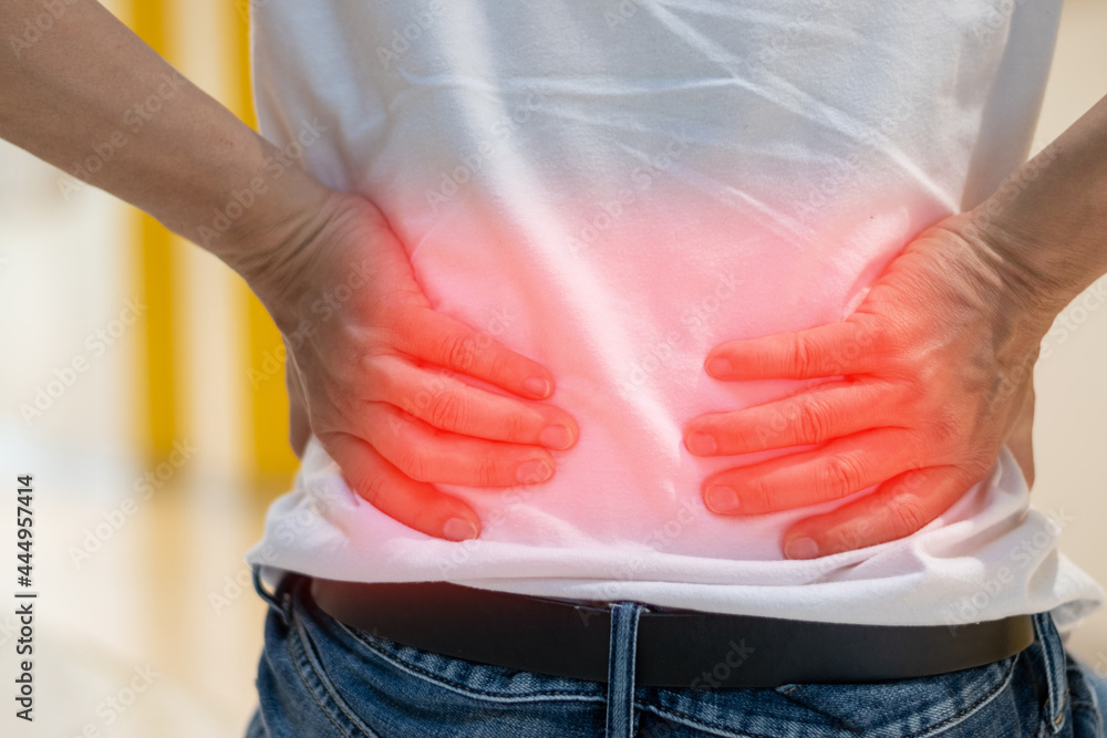 Man's hands on his back with red spot as suffering on backache. Male ...