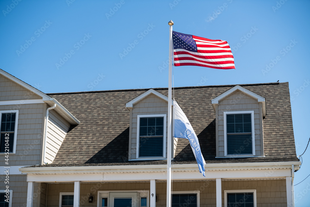 american flag in front of house Stock Photo | Adobe Stock