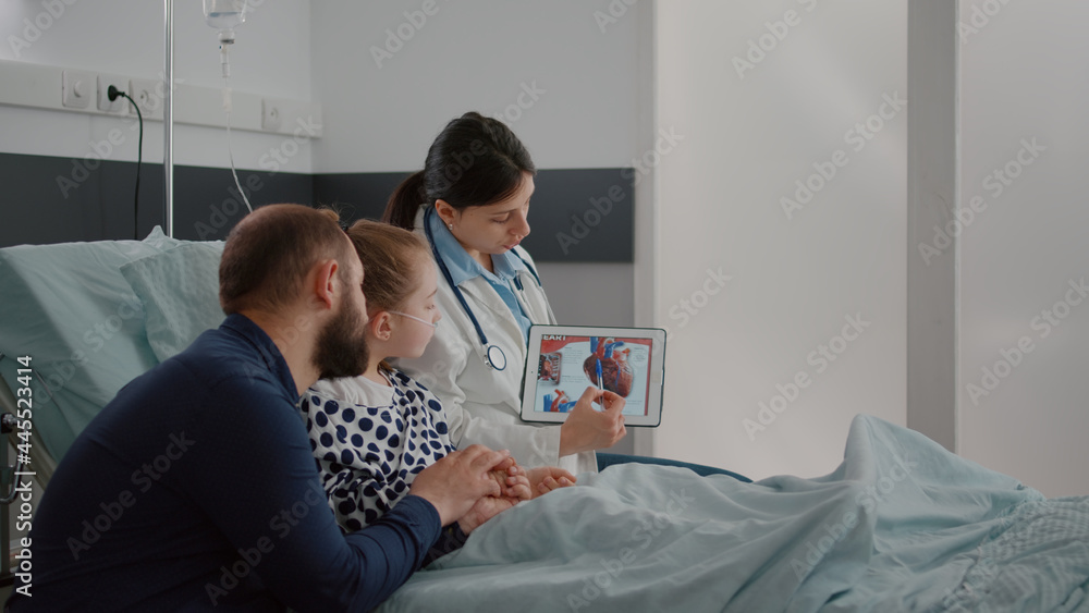 Pediatric cardiologist woman doctor explaining heart illness using ...