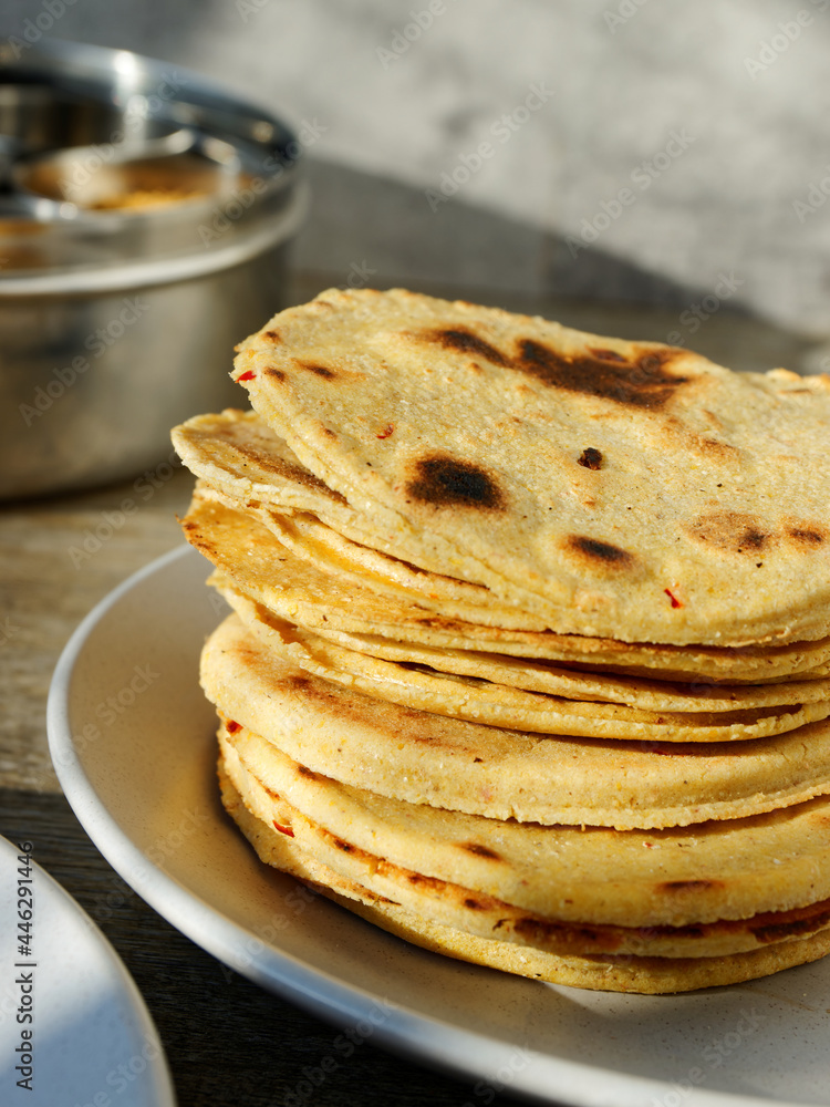 Pile of traditional Indian corn flatbreads Makki ki roti. Stock Photo ...