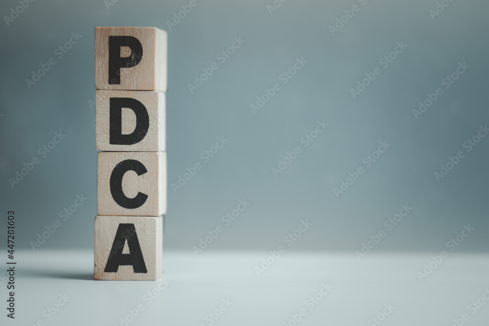 PDCA written in wooden cubes, plan do check act concept Stock Photo ...