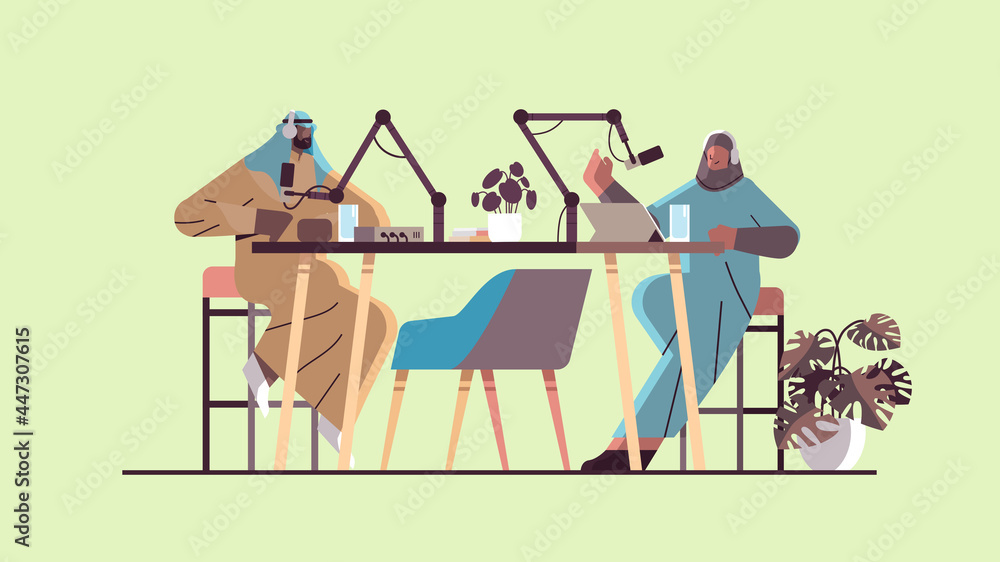 arab podcasters talking to microphones recording podcast in studio ...