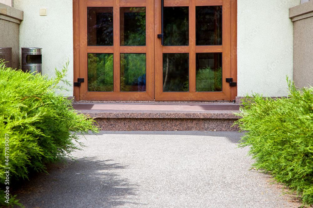 a wooden door with a frame and glass inserts on the facade of a ...