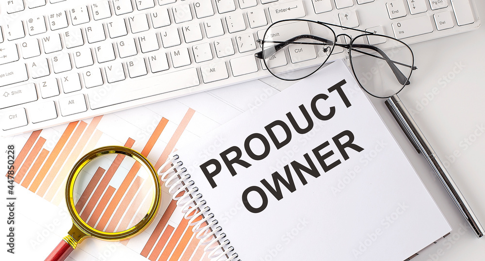 PRODUCT OWNER text written on a notebook with keyboard, chart,and ...