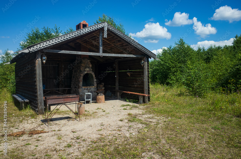 Wooden smithy over summer nature background. Old style log house with ...