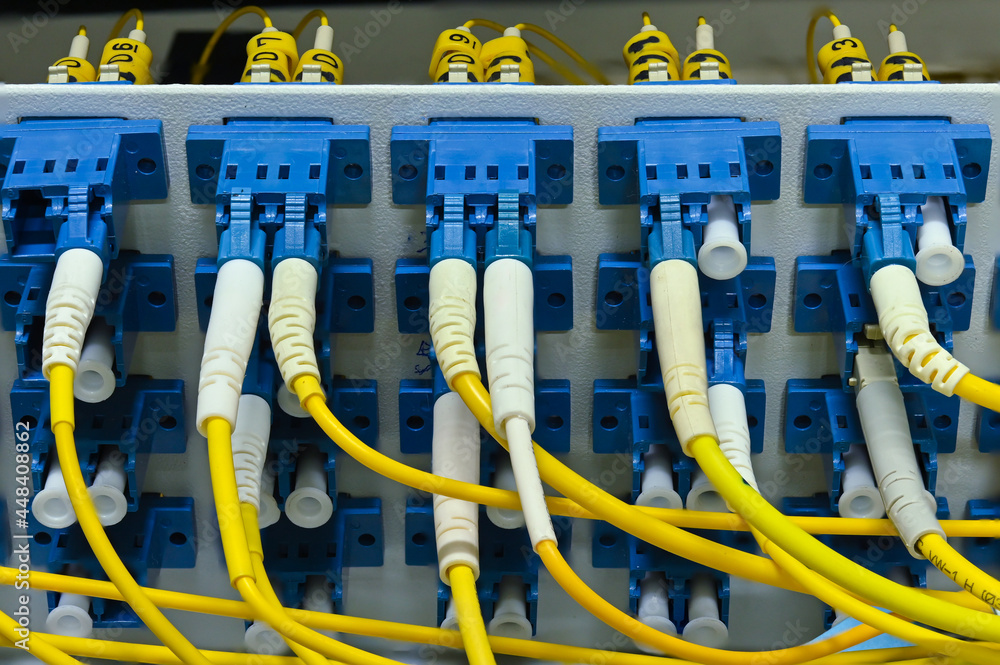 optical distribution panel and fiber cables with connector closeup in ...