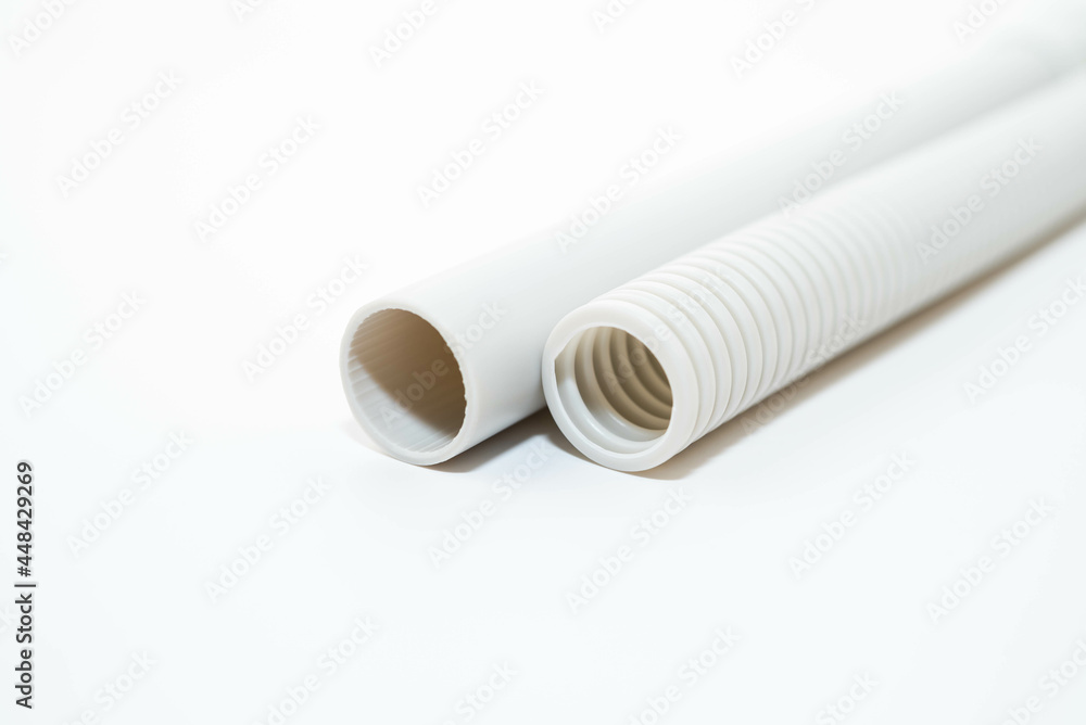 PVC rigid and flexible electrical conduit isolated on white background ...