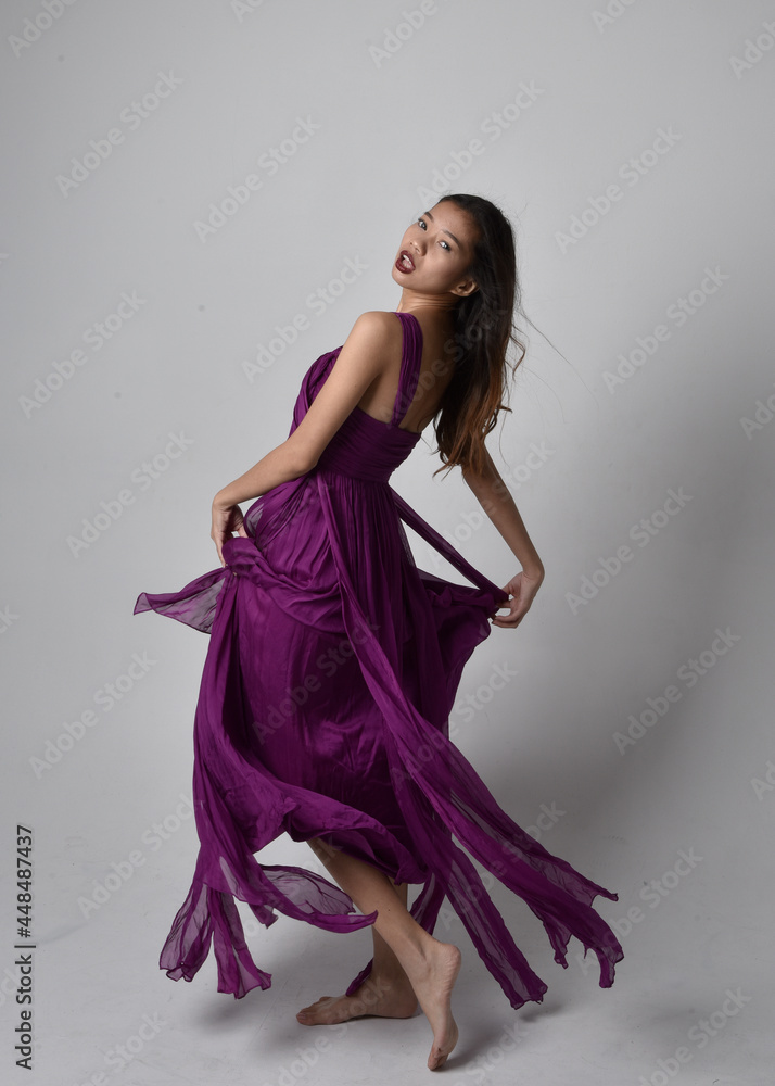Full length portrait of pretty brunette asian girl wearing purple ...