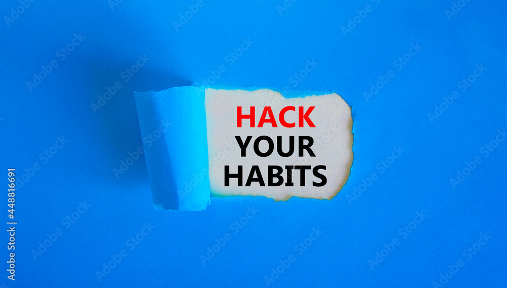 Hack your habits symbol. Words 'Hack your habits' appearing behind torn ...