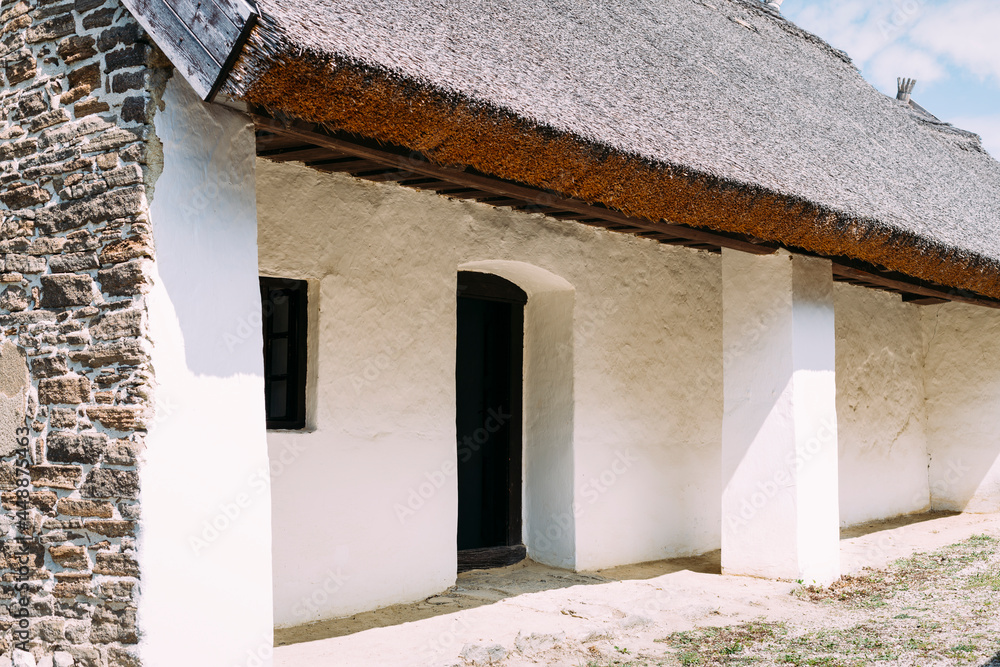 Countryside house made of mud and reed roof Stock Photo | Adobe Stock
