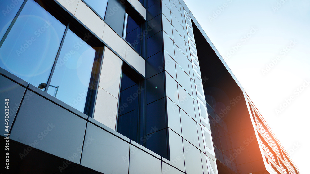 Futuristic facade of a modern office building clad in glass. Glass ...
