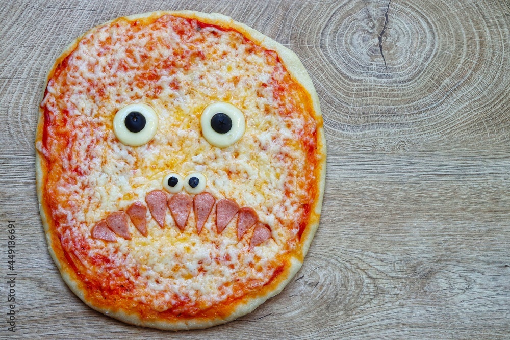 Photo Stock Halloween scary monster face pizza made from pizza dough ...