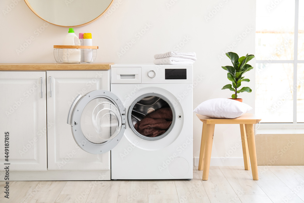 Interior of kitchen with modern washing machine Stock Photo | Adobe Stock