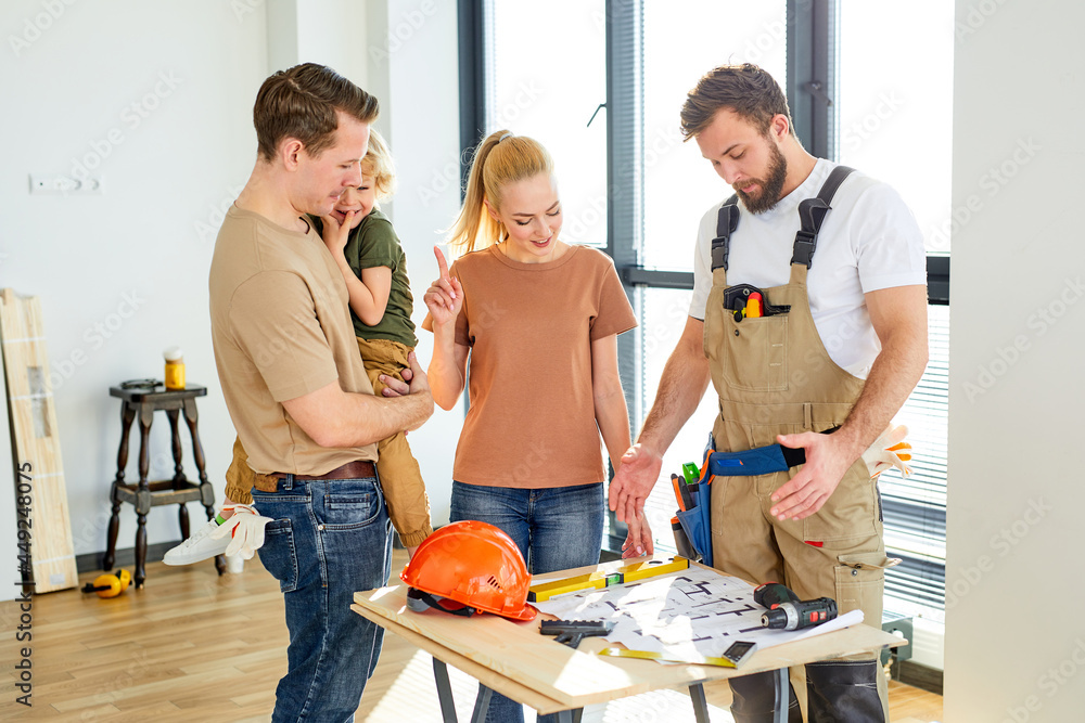 Repairman In Overall Explain House Design To Family In New House, Going ...