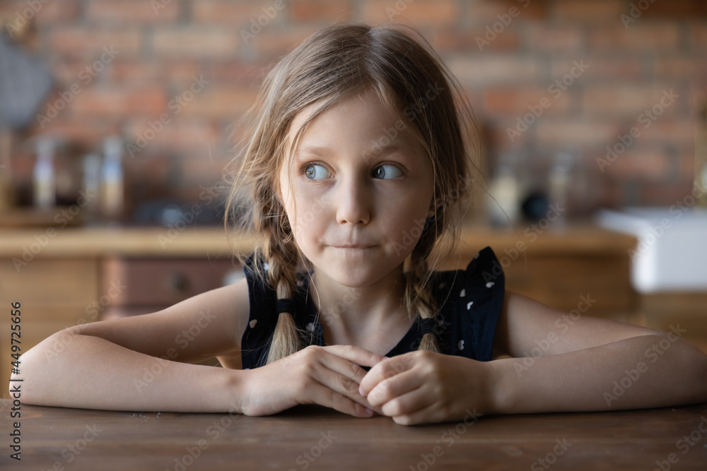 Head shot portrait of sly little girl with guilty scared face and shut ...