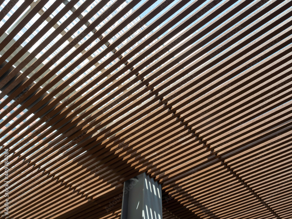 Wooden slats roof, architecture construction with sunlight streaming ...