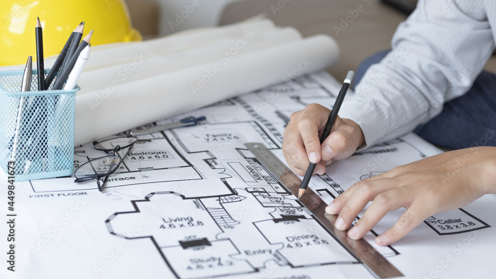 Engineer and Architect concept, Man uses a ruler to measure the floor ...