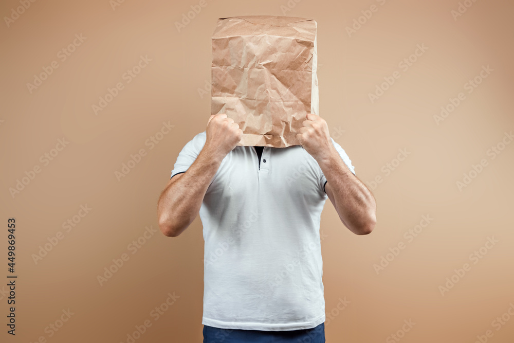 Men put a paper bag over their heads, hold their fists. Isolate on ...