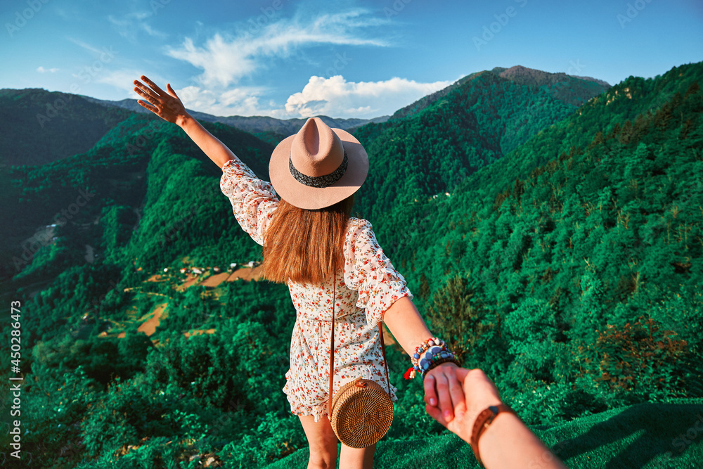 Follow me concept and traveling together. Girl traveler wearing hat ...