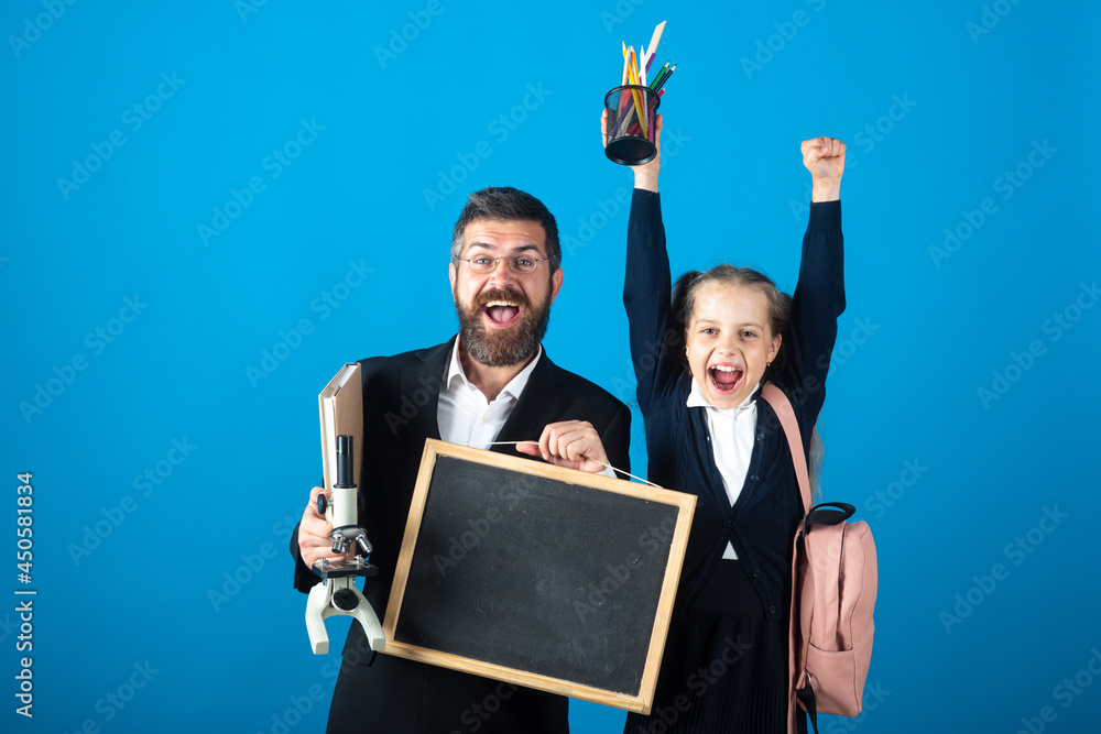 First day at school. Father or teacher and little child school girl in ...