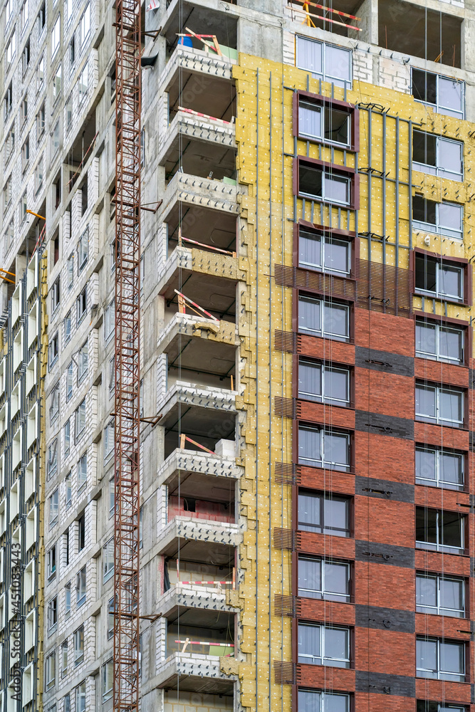 Monolithic concrete frame of apartment building under construction with ...