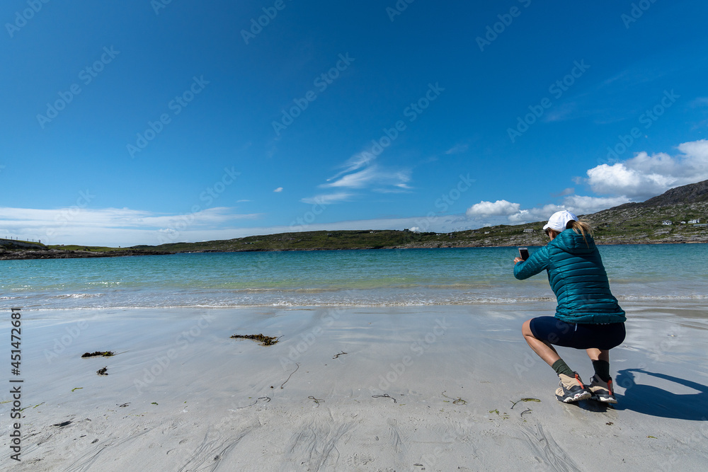 Bright spring morning with a female tourist taking pictures of the ...
