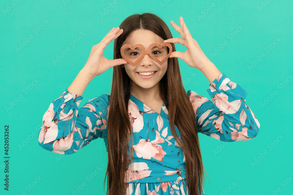 Funny girl child smile wearing heart-shaped glasses for Valentines day ...