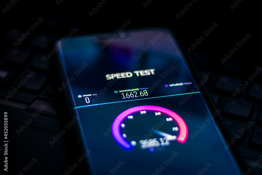 Speedtest on phone. 5G network test. Very fast internet. Testing speed ...