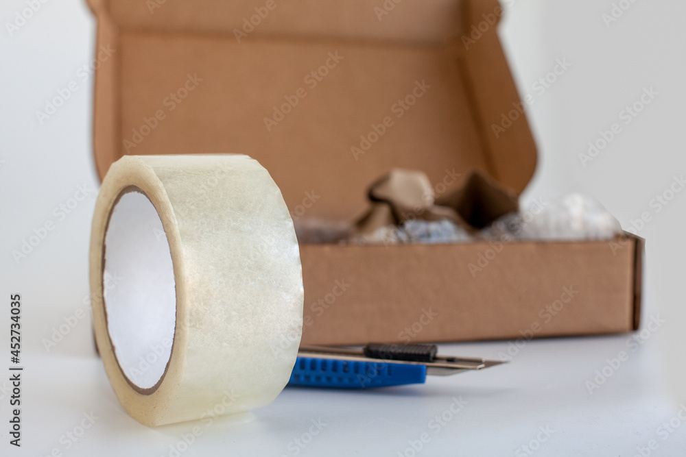 Tools for product packaging. Focus on duct tape. Box and stationery ...