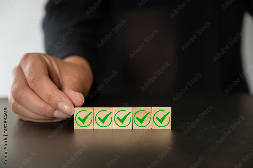 Photo Stock Checklist concept, check mark or tick on wooden blocks ...