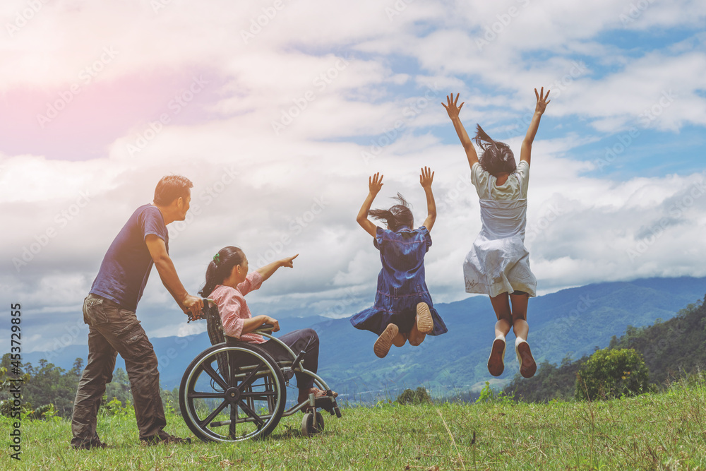 Group of happy disability family holiday concept. Disabled mother in ...