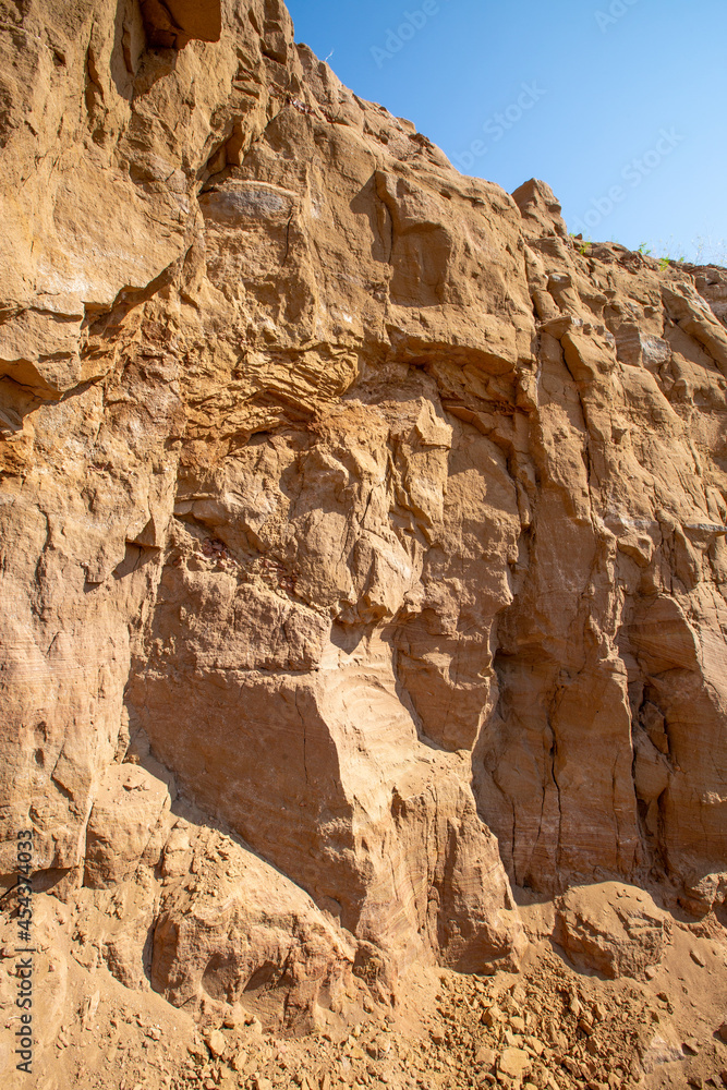 steep ravine slope, sandstone polished by wind and water erosion, stone ...