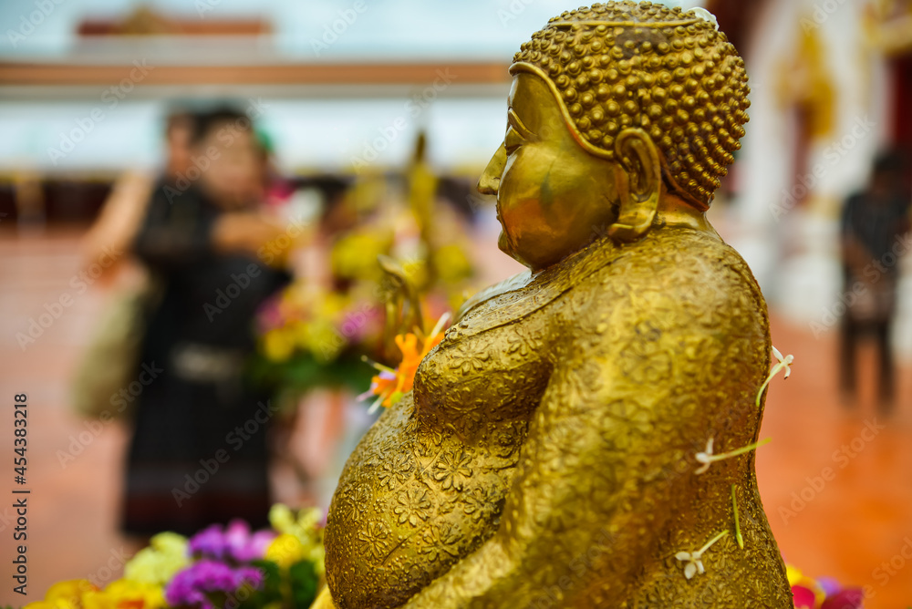 Golden fat Buddha statue in a Thai buddhist temple. Buddhism official ...