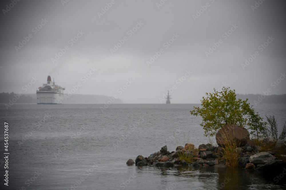 Foto de Stock Arrival of roro cruise ship and the old sailing replica ...